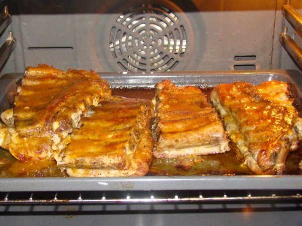 Costite picante la cuptor cu varza calita - Rețetă Petitchef